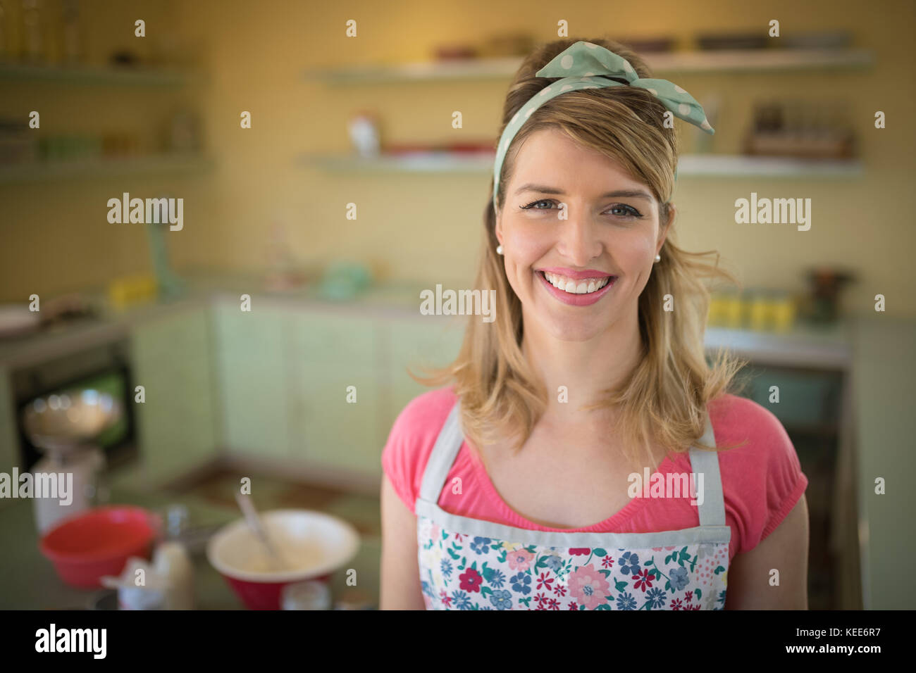 Portrait of waitress standing in restaurant Stock Photo - Alamy