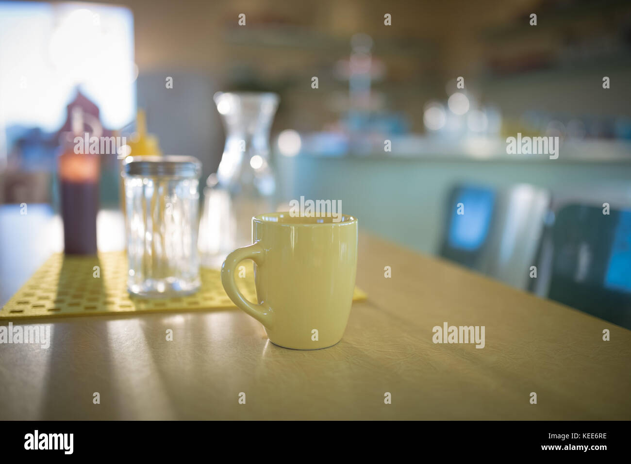 Mug of coffee on a table at restaurant Stock Photo - Alamy