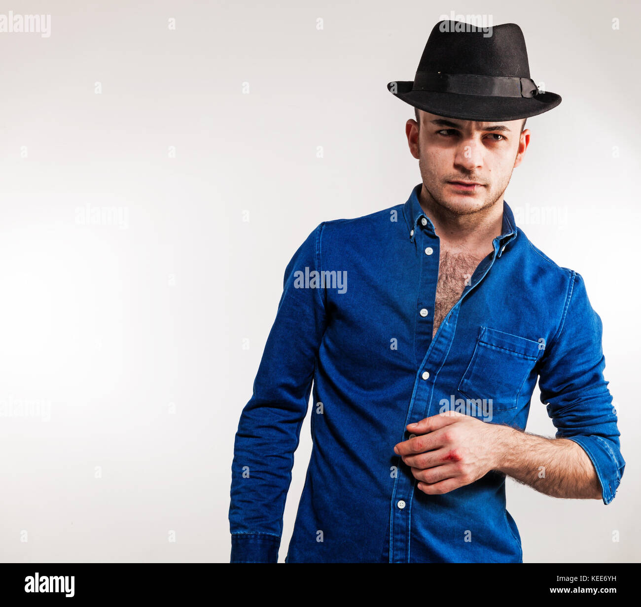 Man on white background, Mysterious look Stock Photo - Alamy