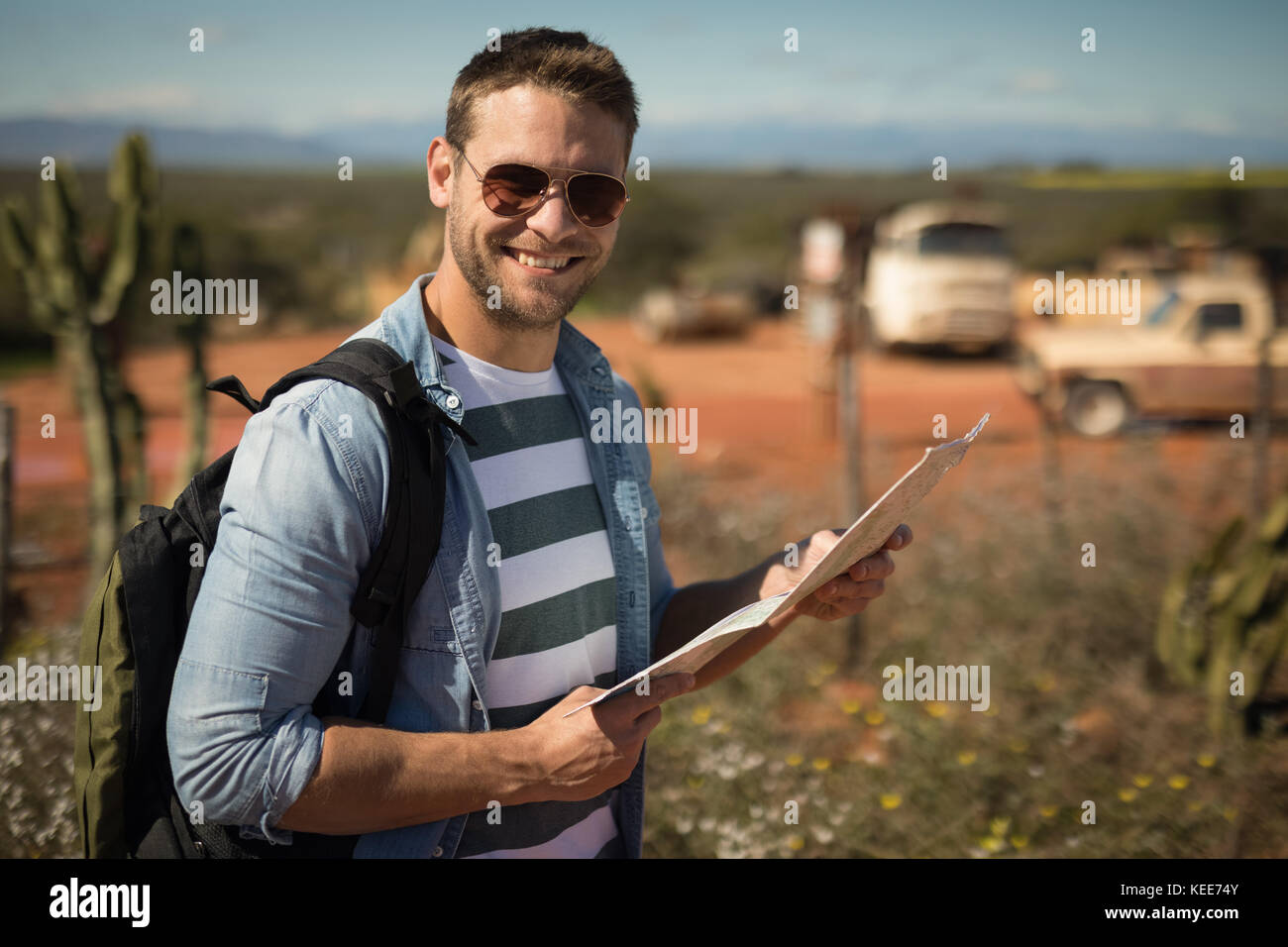 Young man looking at map hi-res stock photography and images - Alamy
