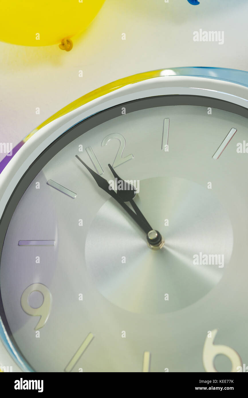 Close-up of balloon and clock hands reaching 12 o clock midnight Stock ...