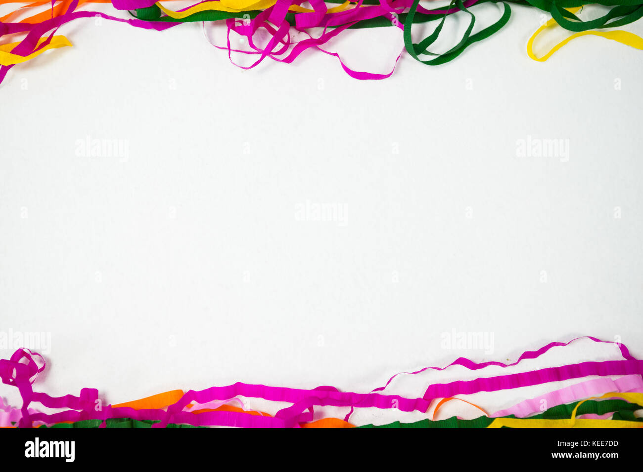 Overhead of colorful streamers arranged on white background Stock Photo ...