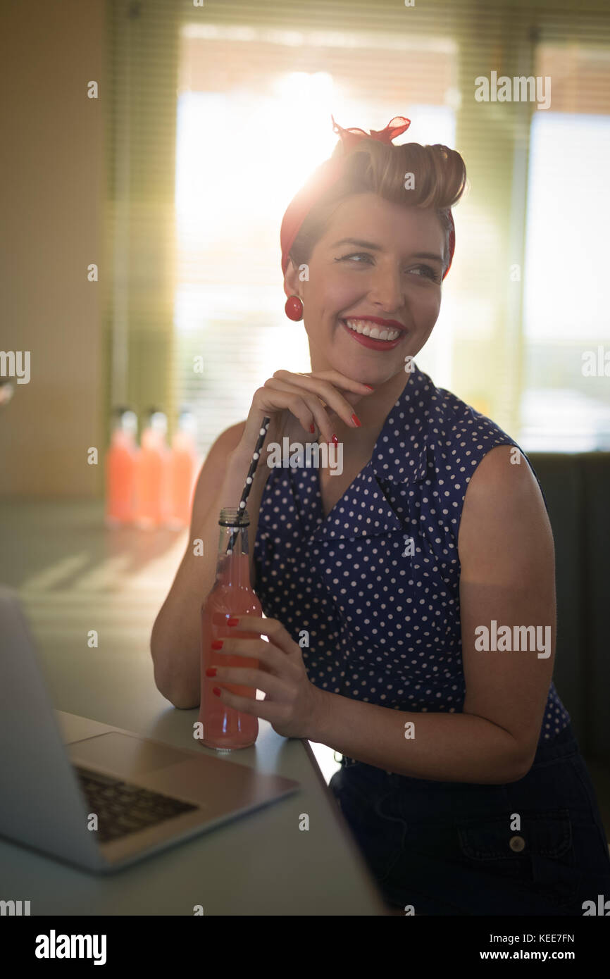 Beautiful woman relaxing in restaurant Stock Photo - Alamy