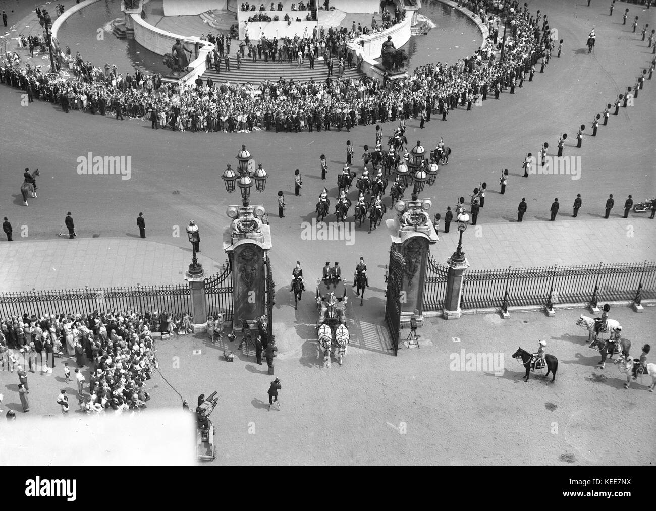 Royal procession of a horse drawn carriage with guard returning to ...