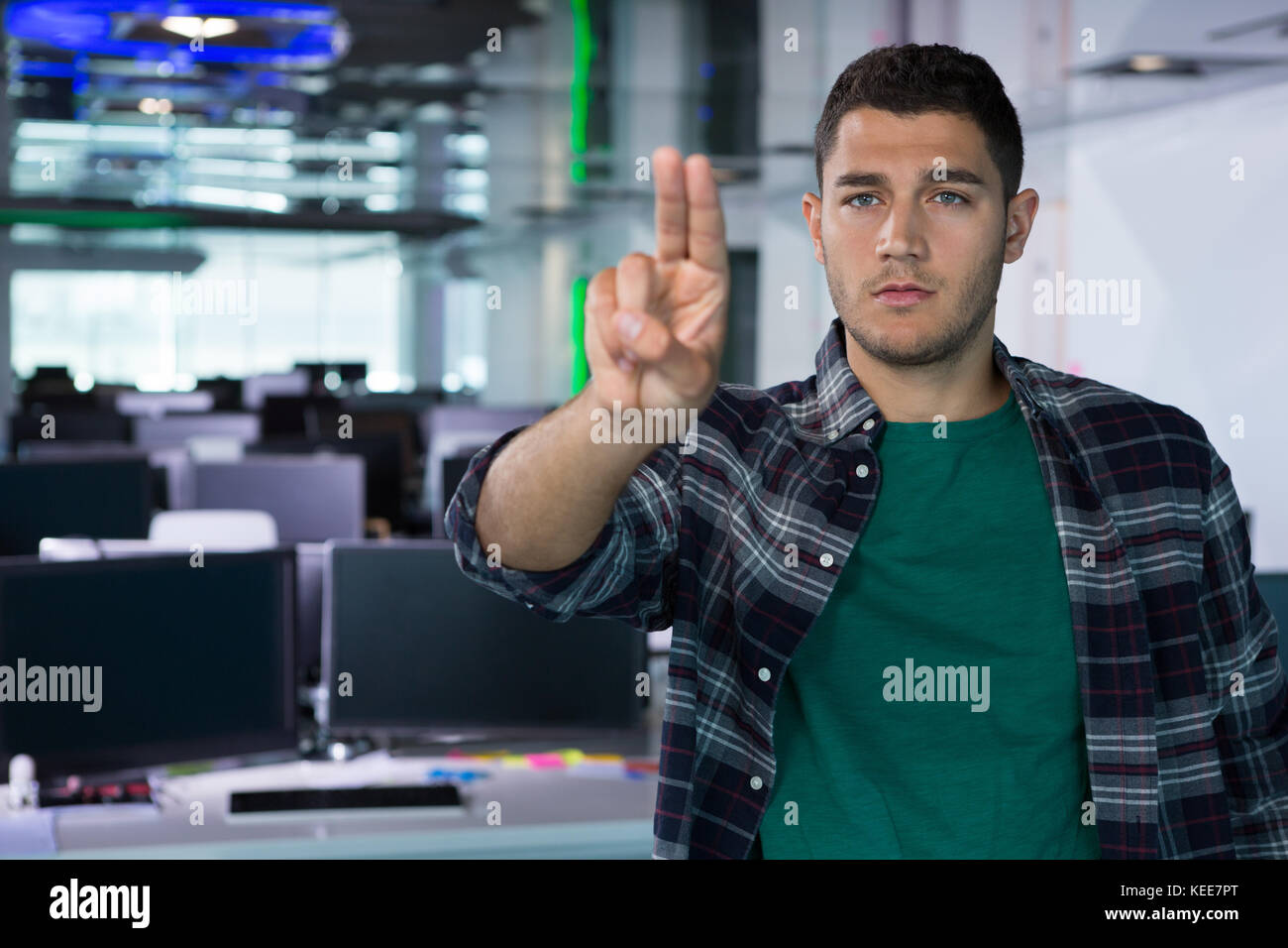 Attentive male executive gesturing in office Stock Photo - Alamy