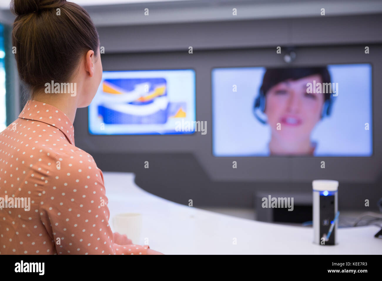 Female executive having video call in boardroom of office Stock Photo ...