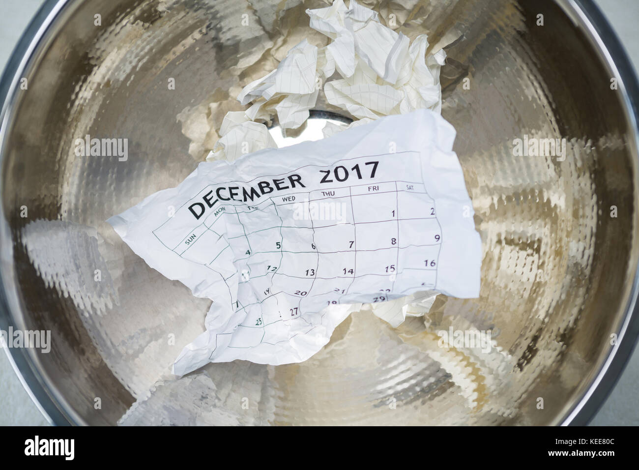 Close-up of crumpled calendar in dustbin Stock Photo - Alamy