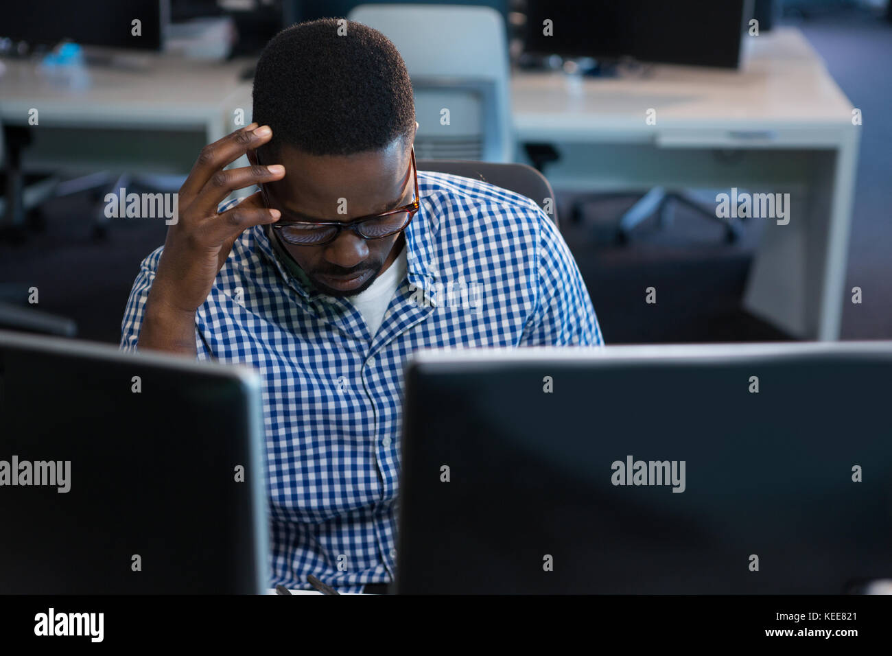 Computer engineer working at desk in office Stock Photo - Alamy