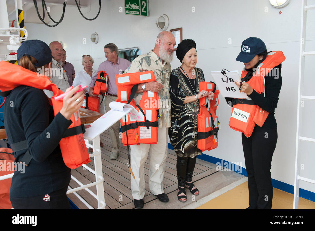 Muster drill with passengers on a cruise ship Stock Photo - Alamy
