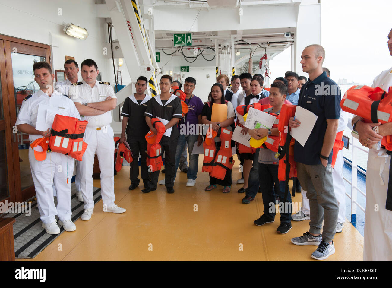 Muster drill with passengers on a cruise ship Stock Photo - Alamy