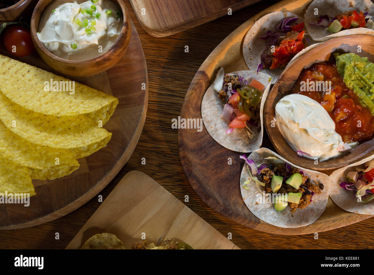 Various mexican food ingredients on wooden table Stock Photo - Alamy