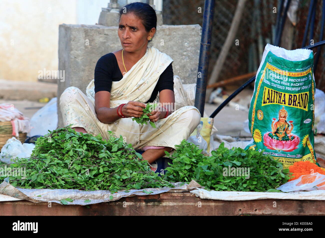 Woman selling mint in Sri Varaaha Lakshmi Narasimha Swamy Temple ...