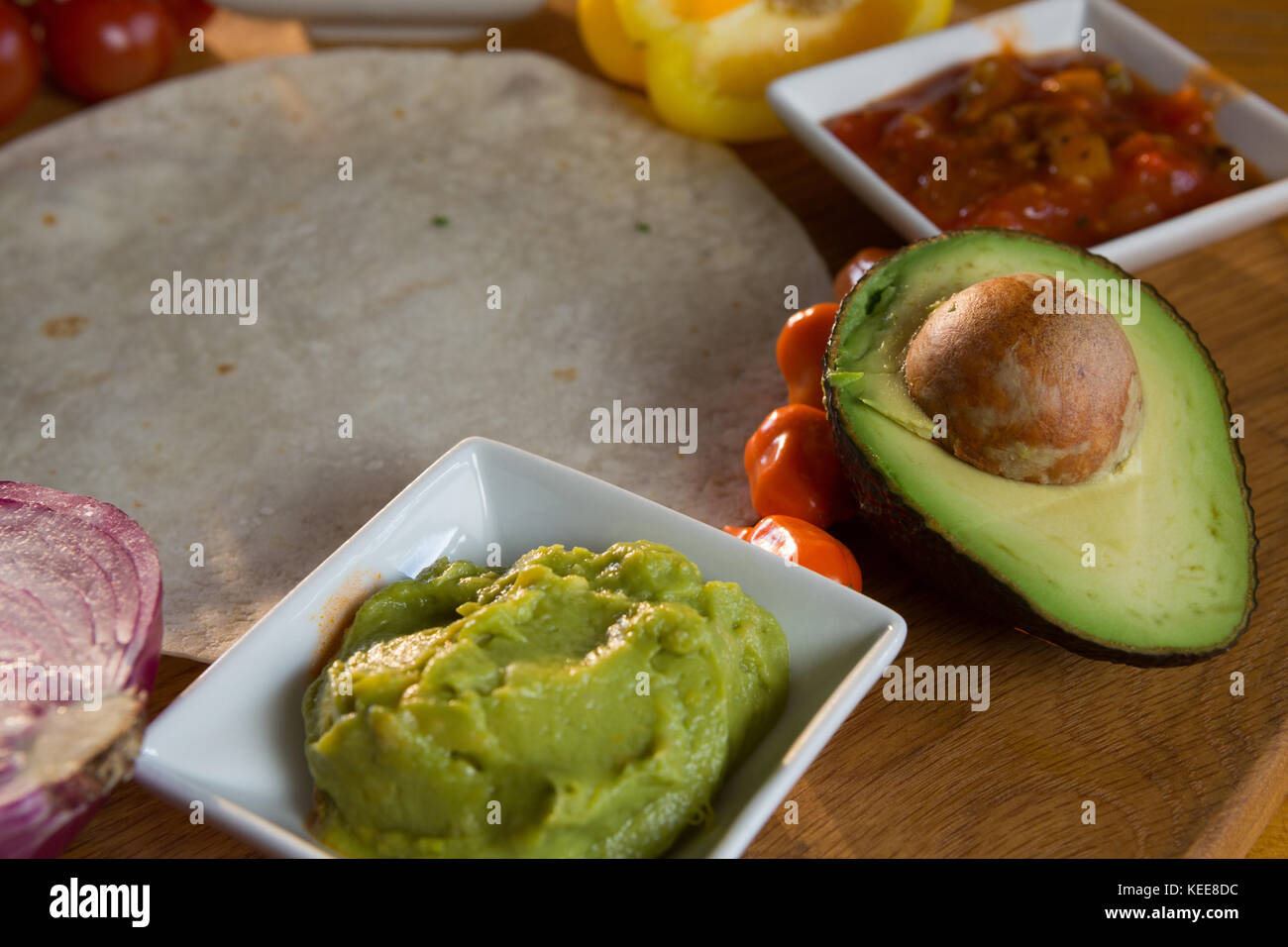 Various mexican food on wooden table Stock Photo - Alamy