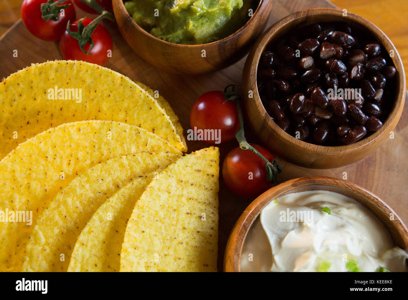 Various mexican food ingredients on wooden table Stock Photo - Alamy