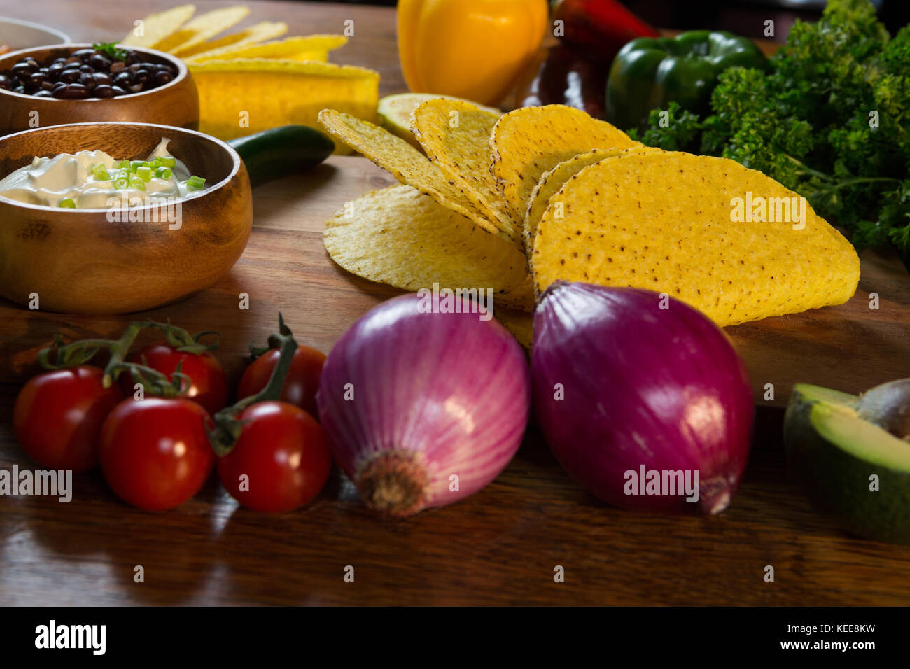 Various mexican food ingredients on wooden table Stock Photo - Alamy
