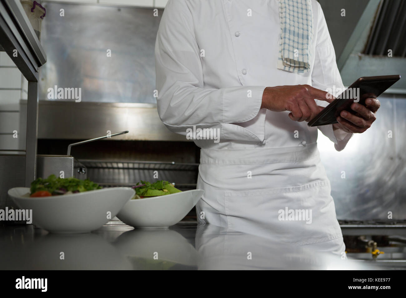Senior chef in uniform using hi-res stock photography and images - Alamy