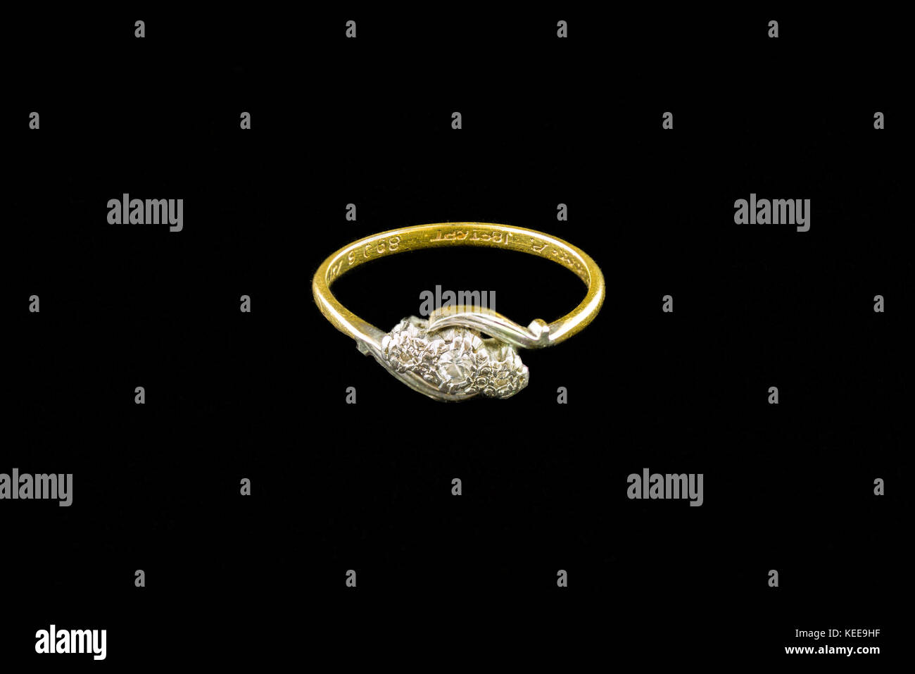 Ladies antique gold diamond ring with three diamonds inset and held ...