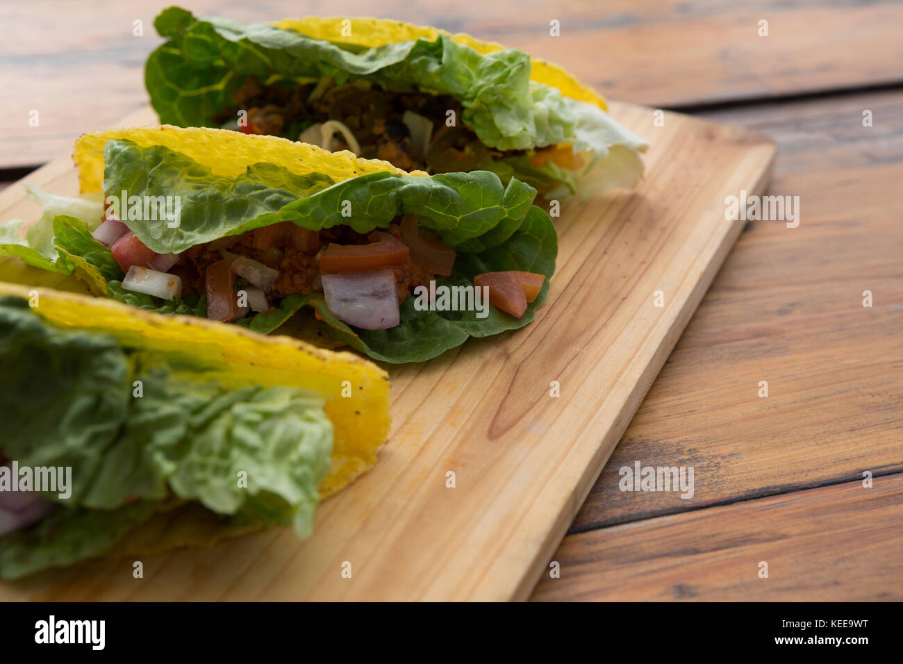 Mexican tacos on wooden tray on table Stock Photo - Alamy