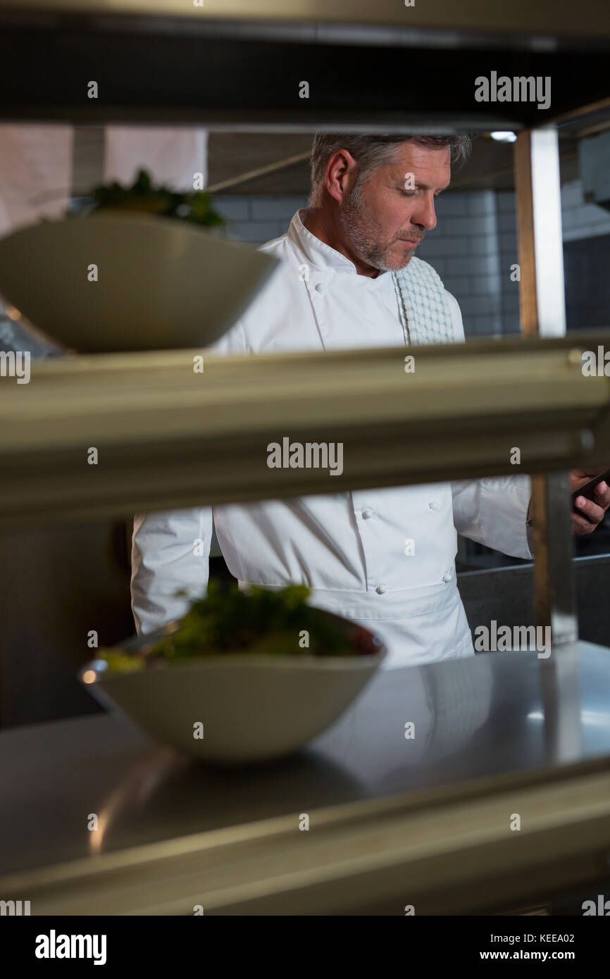 Male chef using mobilephone hi-res stock photography and images - Alamy