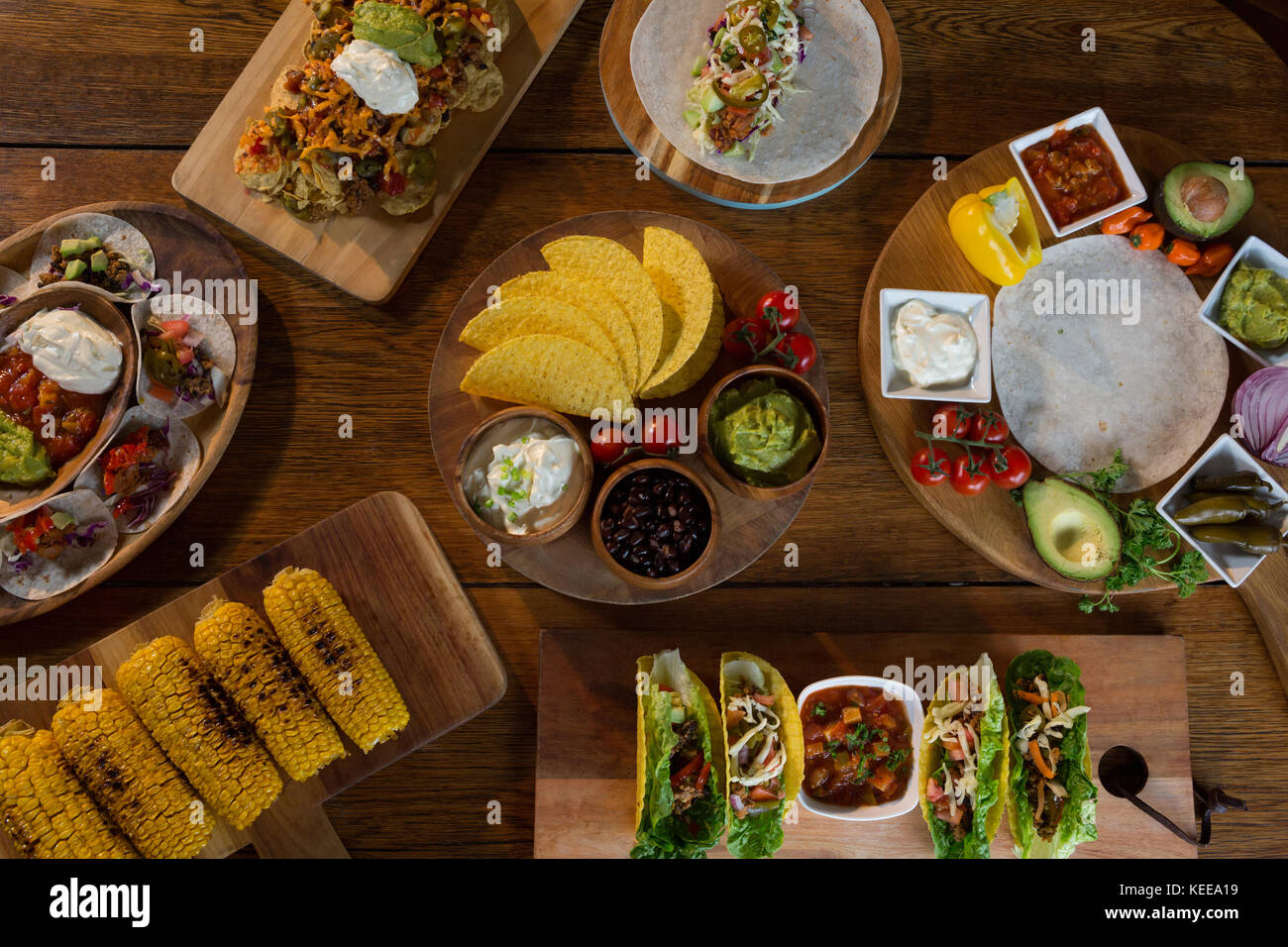 Various mexican food ingredients on wooden table Stock Photo - Alamy
