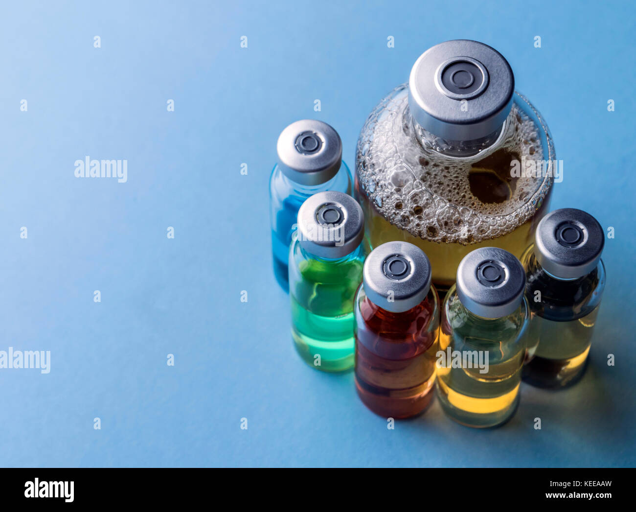 Several vials and syringe in laboratory, conceptual image Stock Photo - Alamy