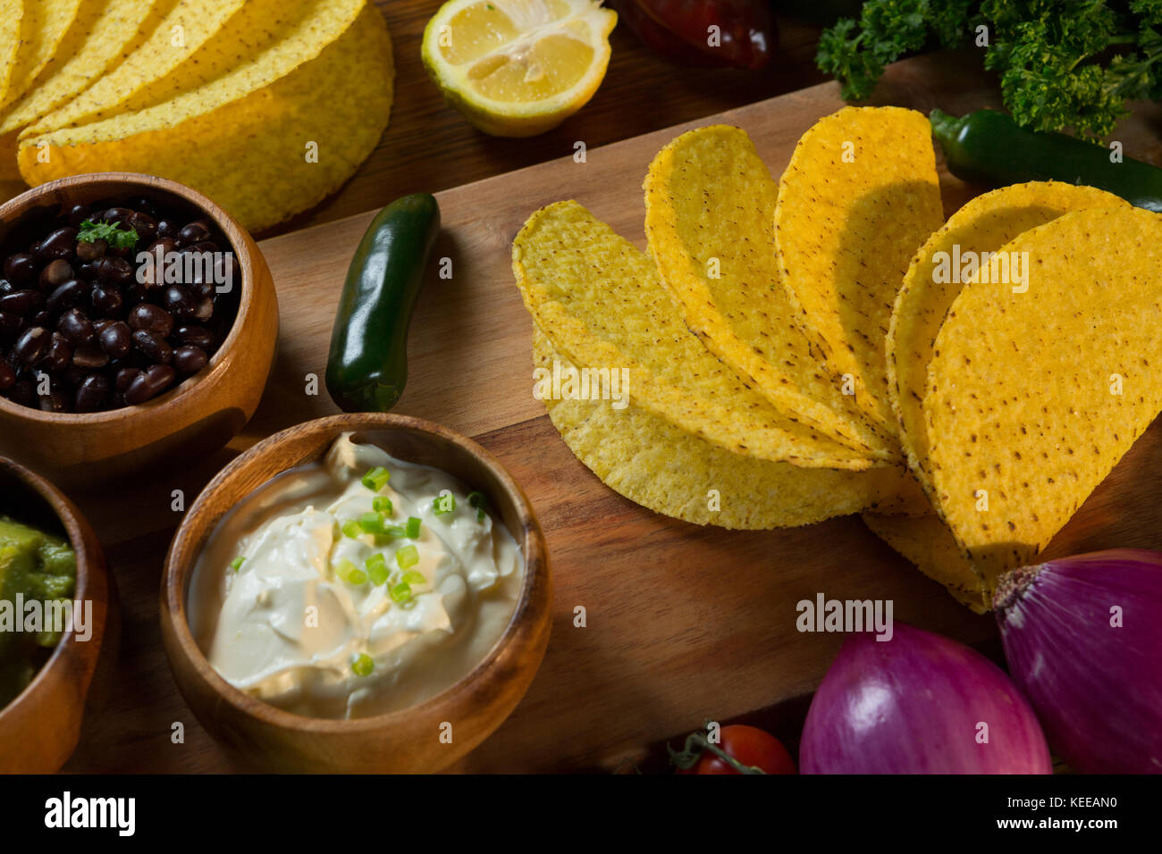 Various mexican food ingredients on wooden table Stock Photo - Alamy