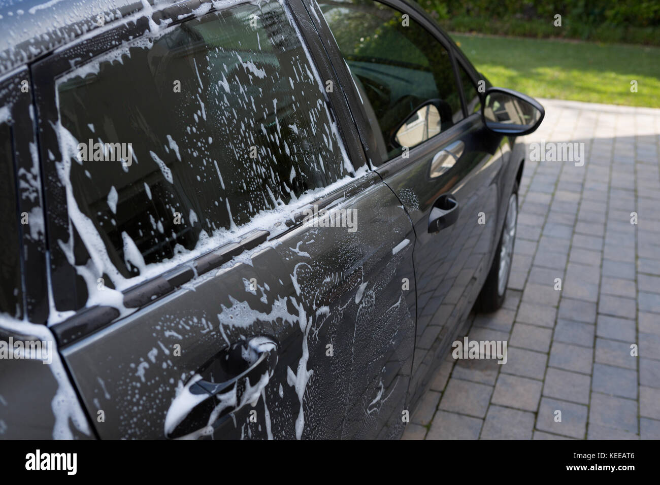 Half washed car with soap foam at outdoors Stock Photo - Alamy