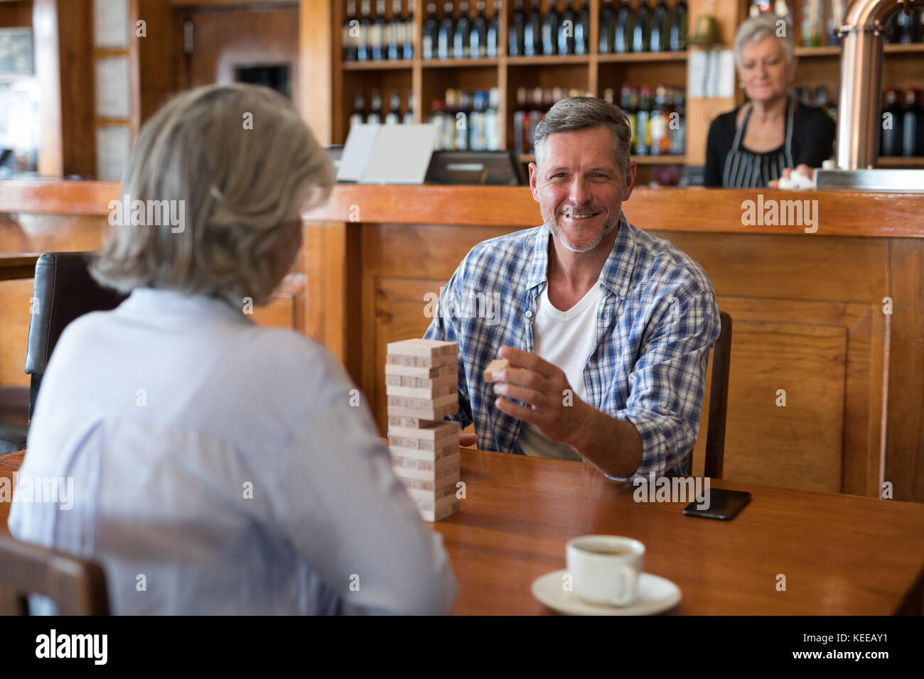 Friends playing jenga High Resolution Stock Photography and Images - Alamy