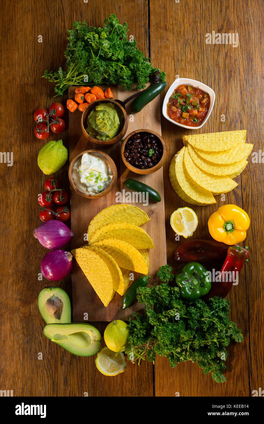 Various mexican food ingredients on wooden table Stock Photo - Alamy