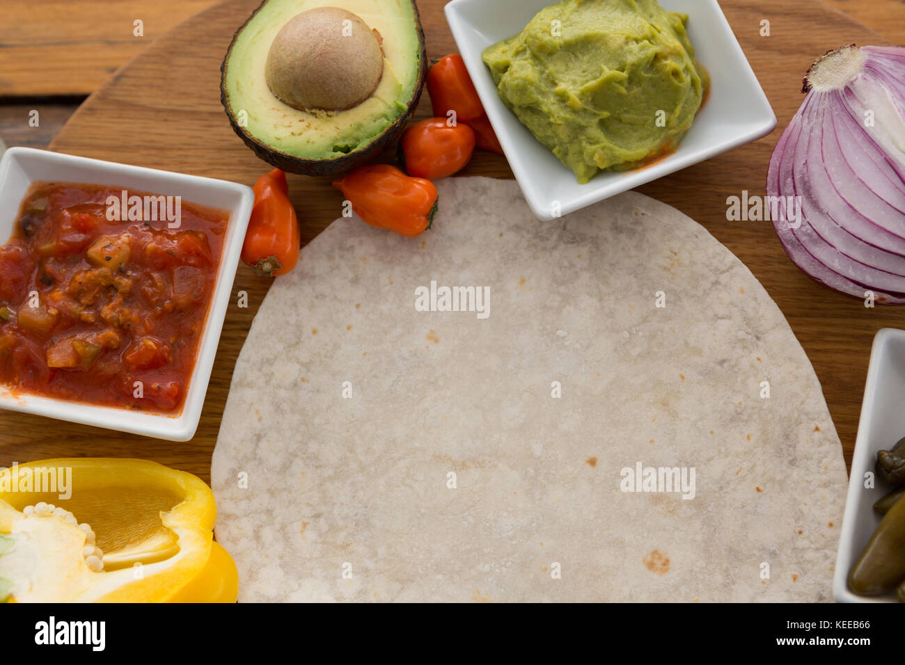 Various mexican food ingredients on wooden table Stock Photo - Alamy
