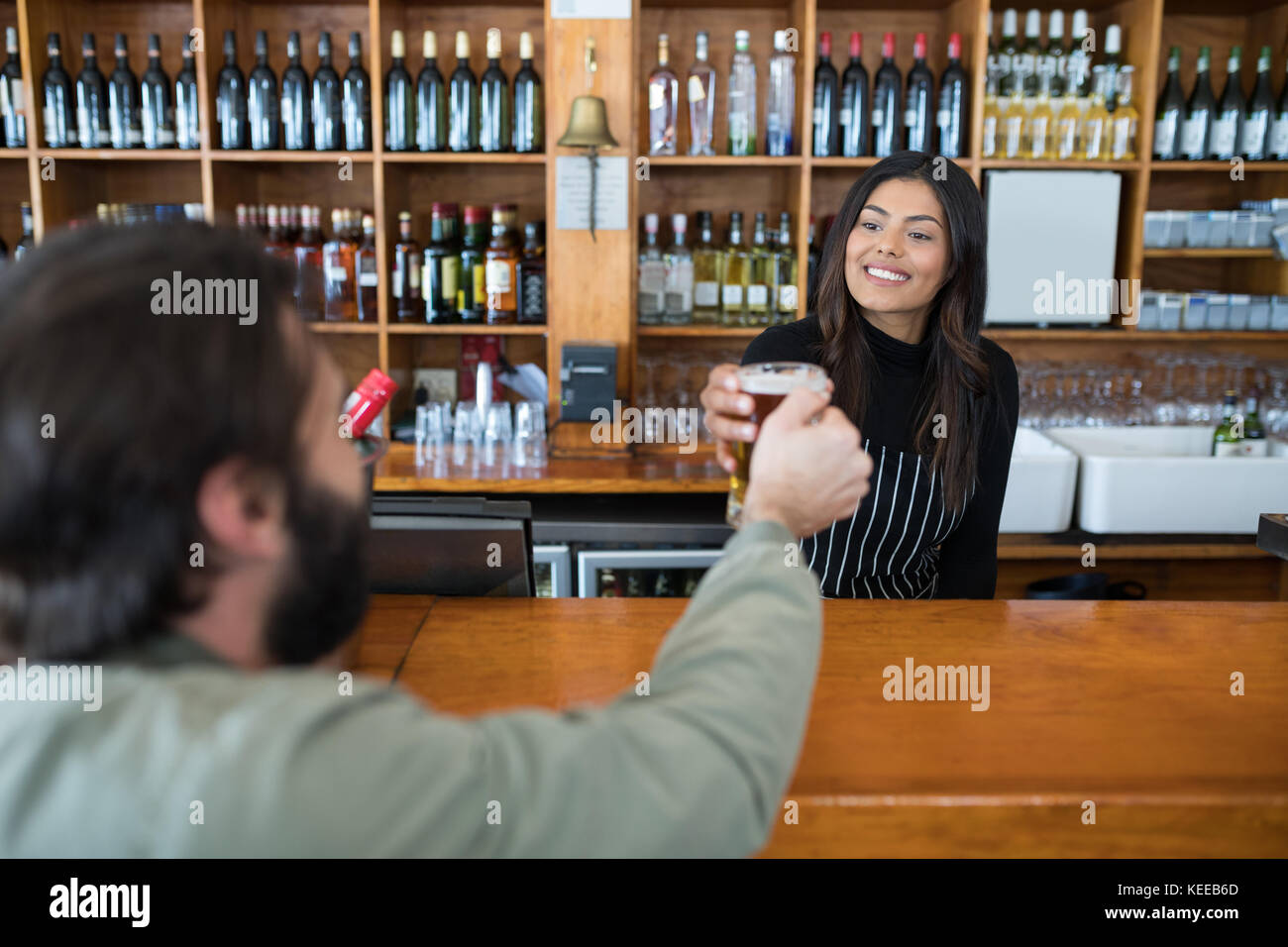 Woman serving beer in pub hi-res stock photography and images - Alamy