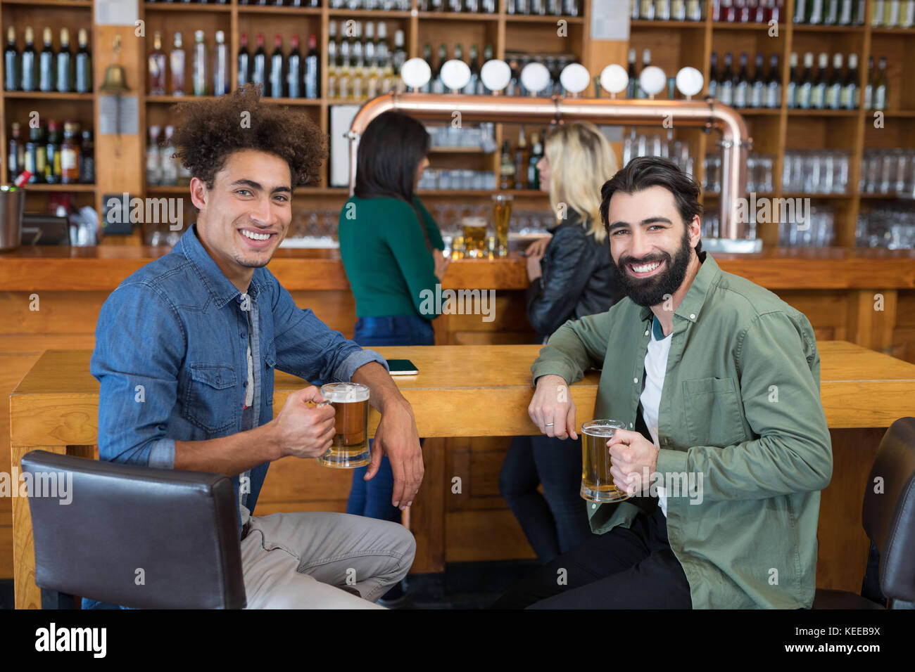 Two friends having beer bar hi-res stock photography and images - Alamy