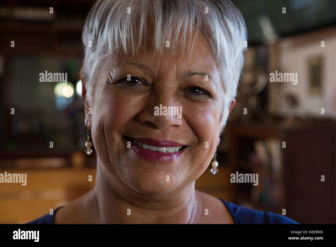 Portrait of waitress smiling near cafe counter Stock Photo - Alamy