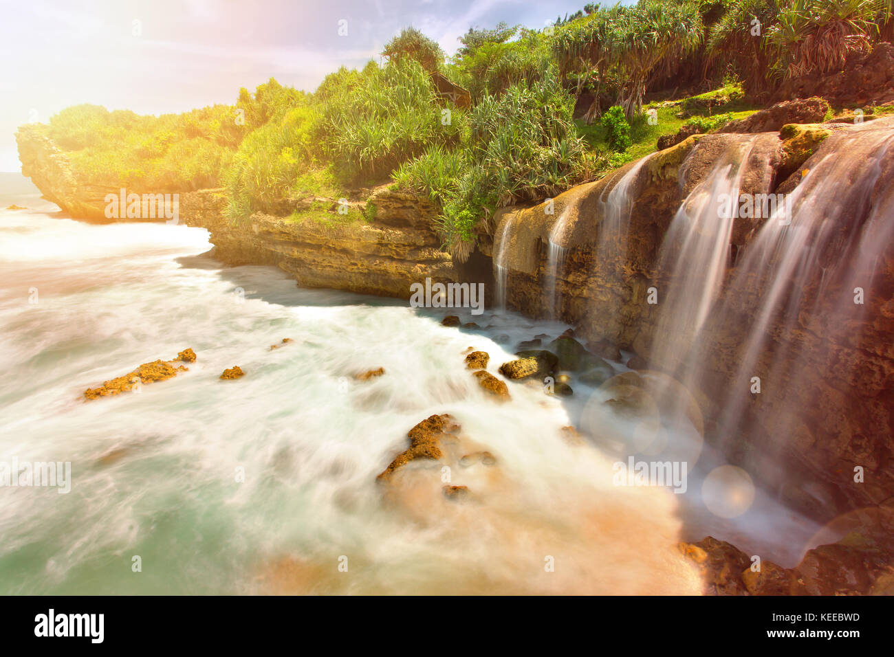 Beautiful Jogan waterfall falling to the ocean. Java, Indonesia Stock ...