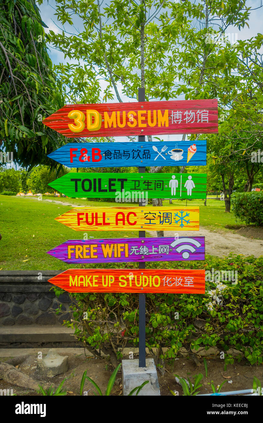 BALI, INDONESIA - MARCH 08, 2017: Informative sign in colorful arrows ...