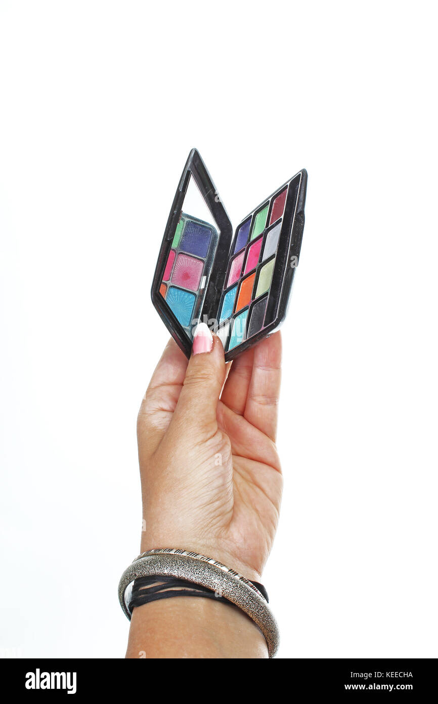Woman hand holding makeup eyeshadow palette on isolated white cutout ...