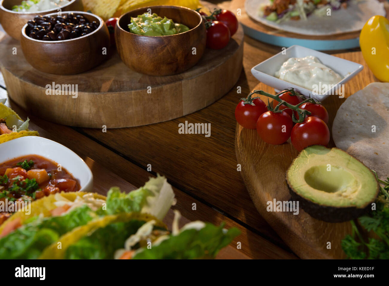 Various mexican food ingredients on wooden table Stock Photo - Alamy