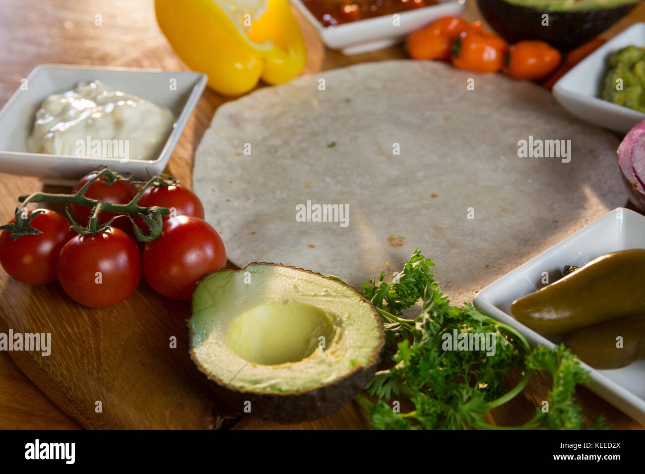 Various mexican food ingredients on wooden table Stock Photo - Alamy