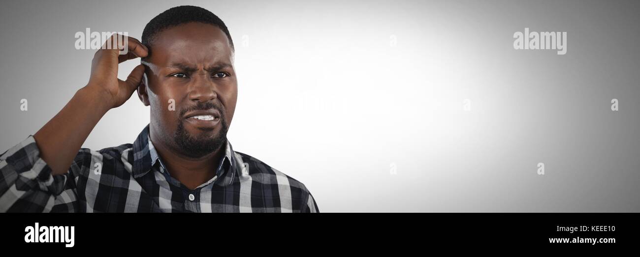 Digital composite of Man thinking hard and confused with grey ...