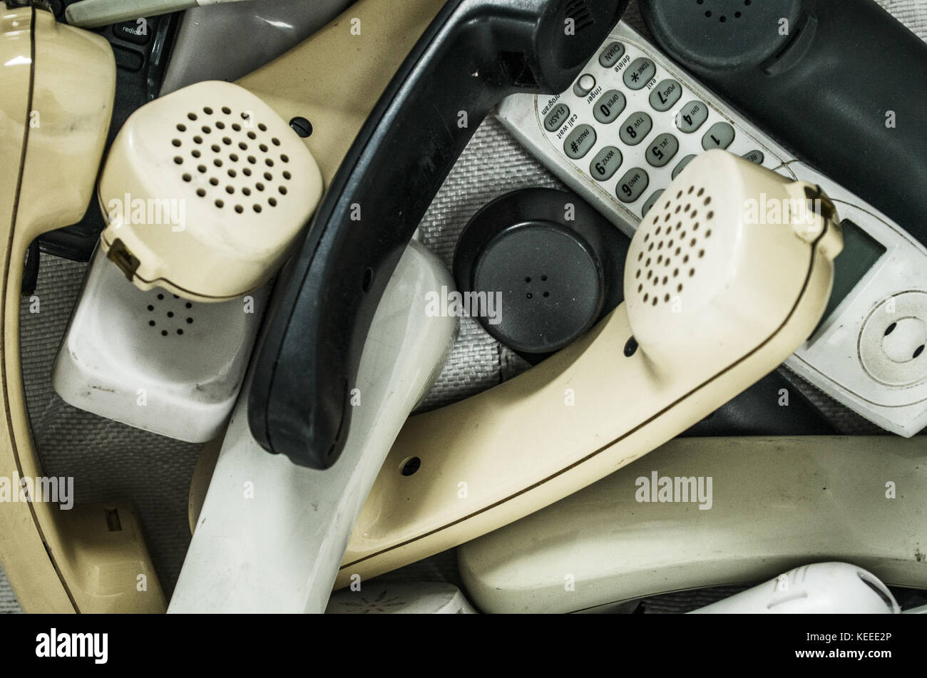 Close up of a pile of old, broken, and dusty laptops in a pile for ...