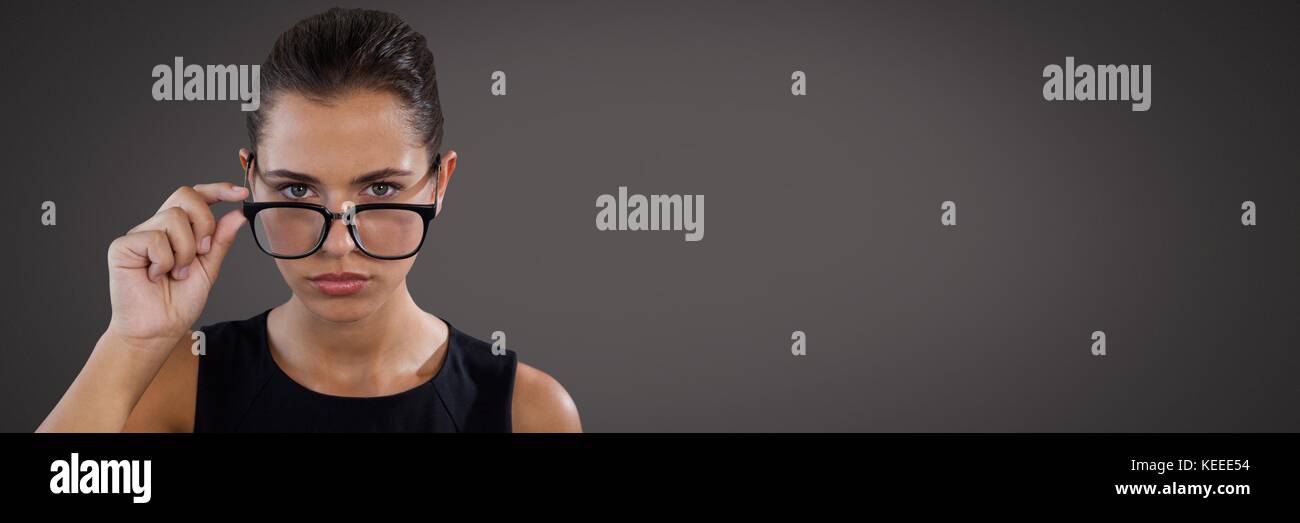 Woman peering over computer hi-res stock photography and images - Alamy