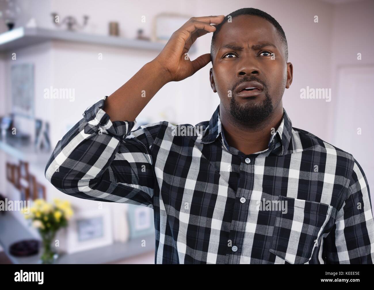 Digital composite of man thinking at home Stock Photo - Alamy