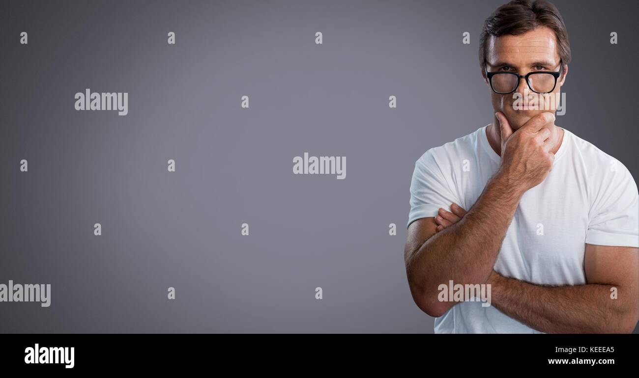 Digital composite of Man thinking with grey background Stock Photo - Alamy