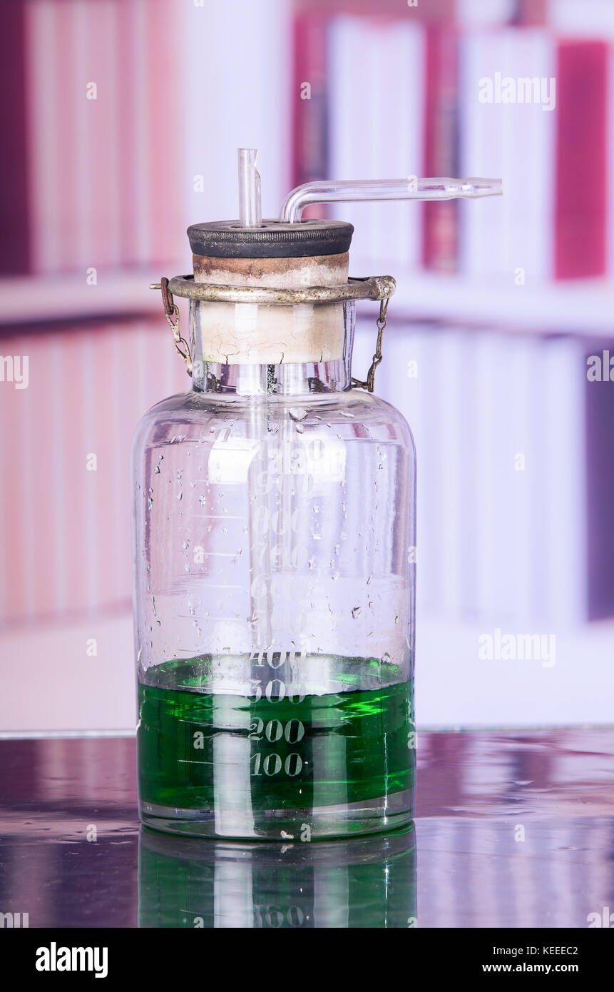Close up of a medical laboratory, with a jar of laboratory with a green ...