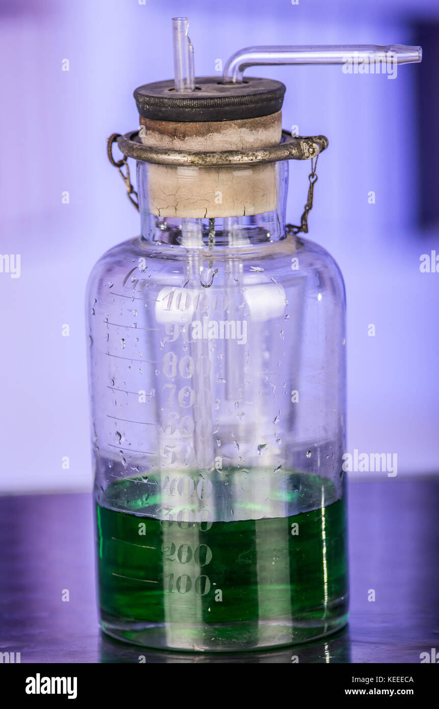 Close up of a medical laboratory, with a jar of laboratory with a green ...
