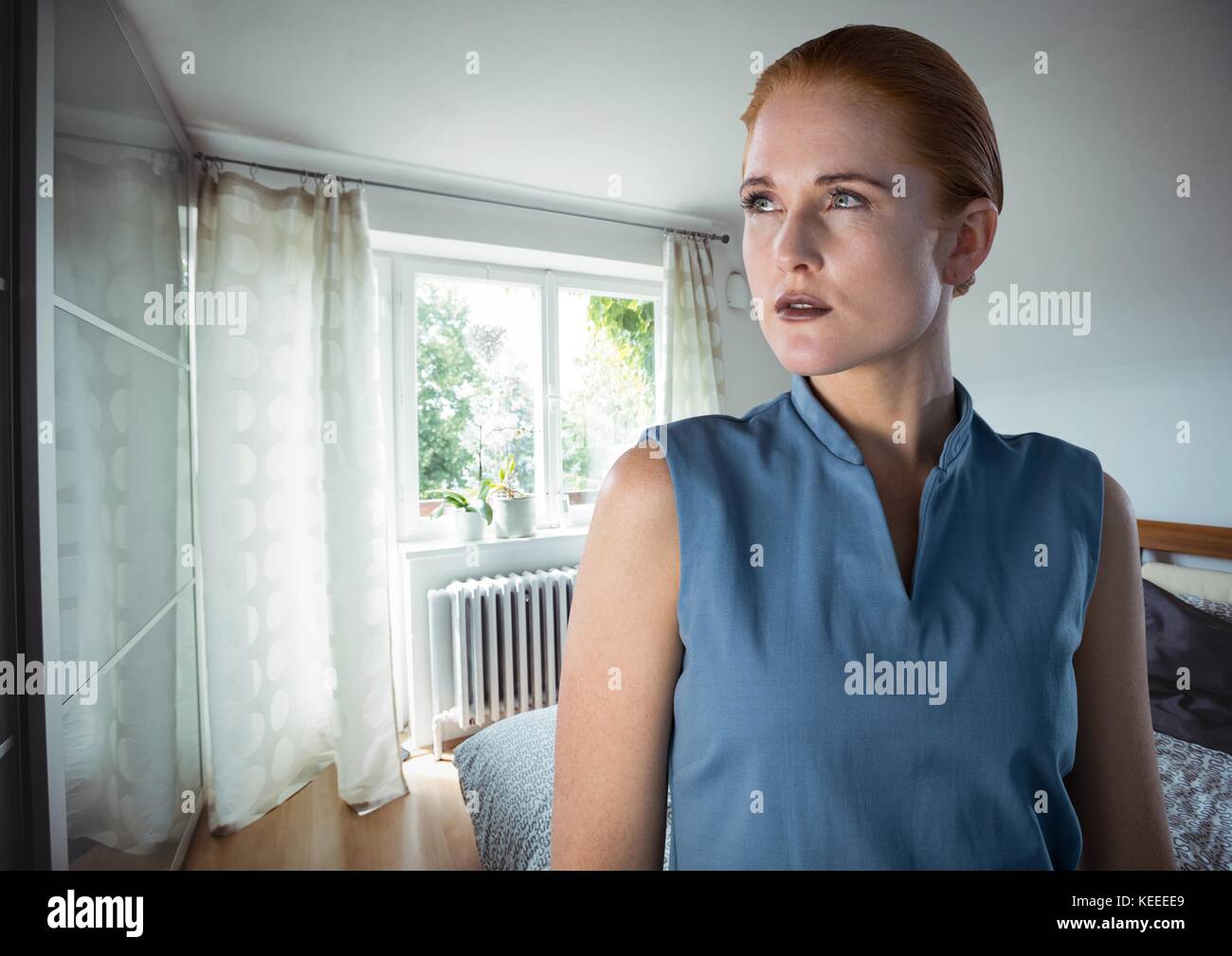 Digital composite of Sharp woman thinking by window Stock Photo - Alamy