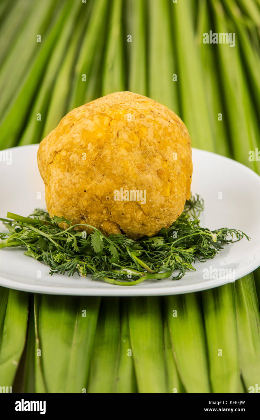 Bolon, an ecuadorian typical food on a white plate with a blurred ...