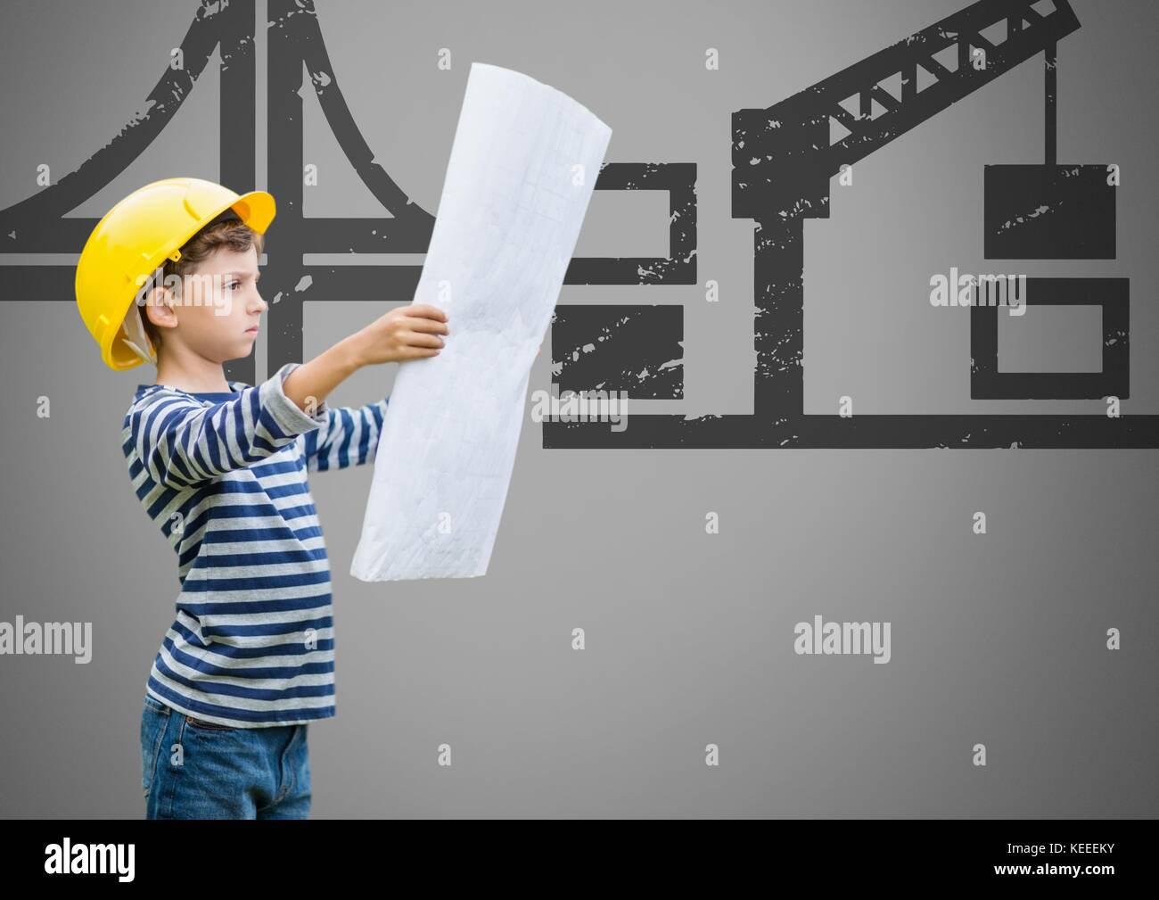 Child architect blueprints hard hat hi-res stock photography and images ...