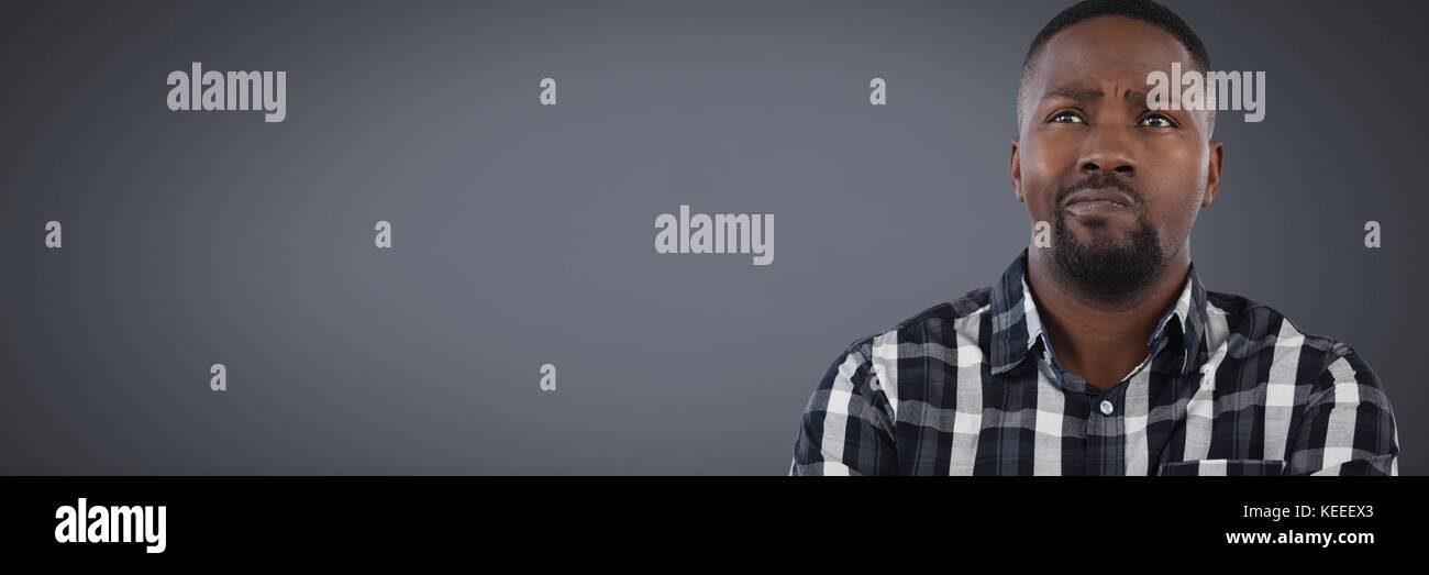 Digital composite of man thinking with grey background Stock Photo - Alamy