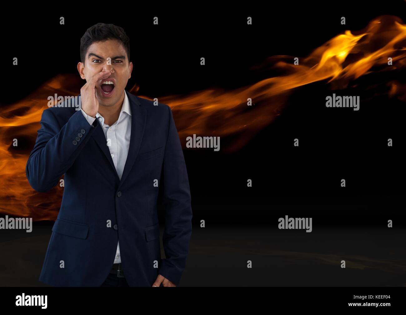 Digital composite of Businessman shouting with fire Stock Photo - Alamy
